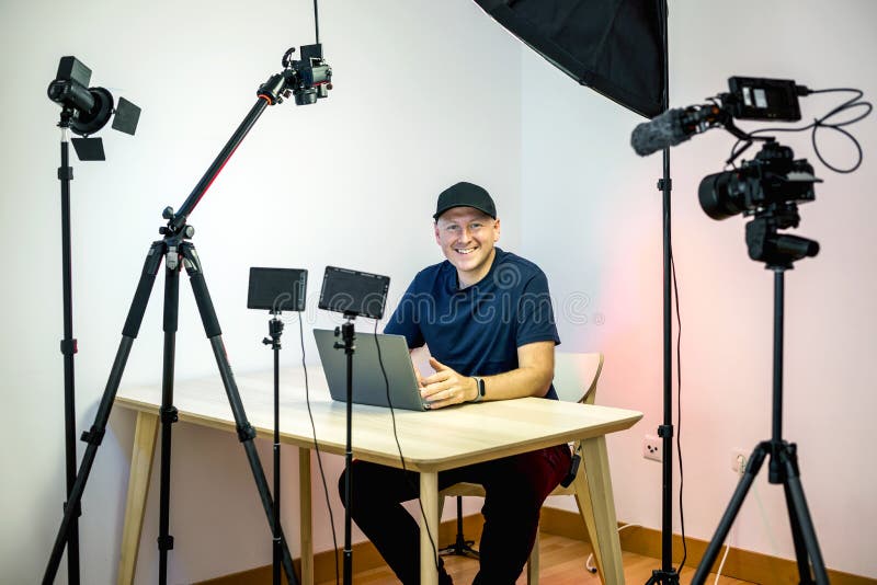 An Influencer with a Laptop Creating Content in His Studio Stock Image ...