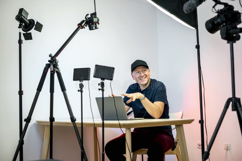 An Influencer with a Laptop Creating Content in His Studio Stock Image ...