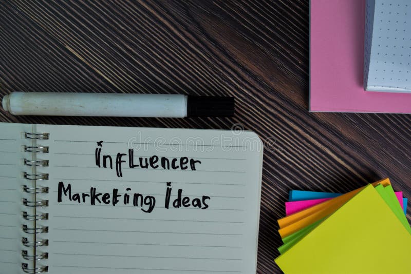 Influencer Marketing Ideas Write on a Book Isolated Wooden Table Stock ...