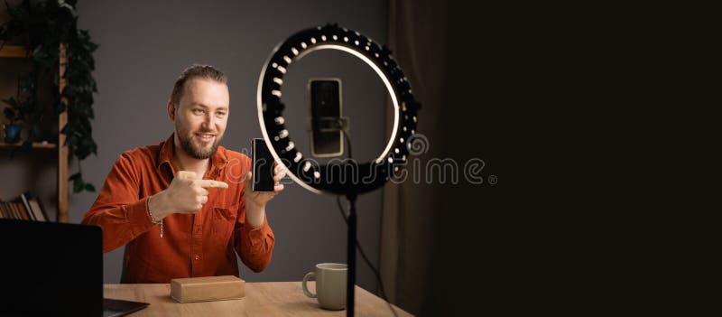 Unboxing Video. Arabic Man in a Santa Hat at Home Shows His Subscribers a New Laptop during a ...