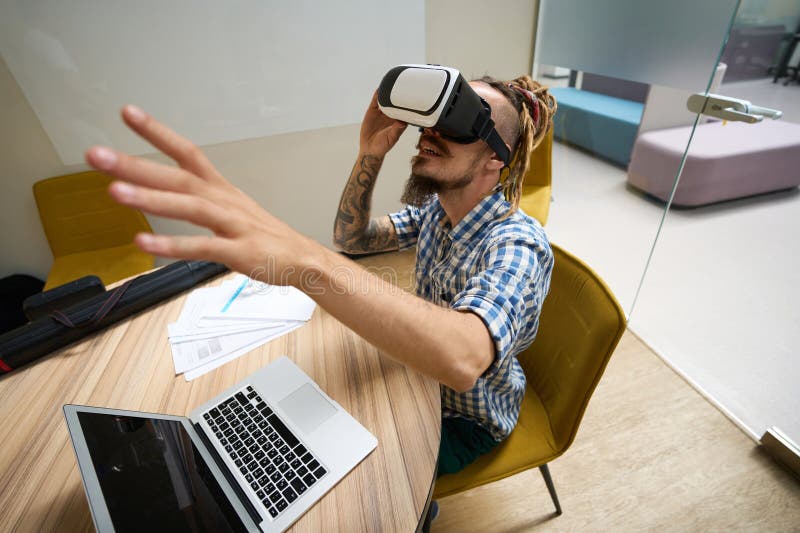 Informal Guy Uses a Virtual Reality Headset Stock Photo - Image of ...