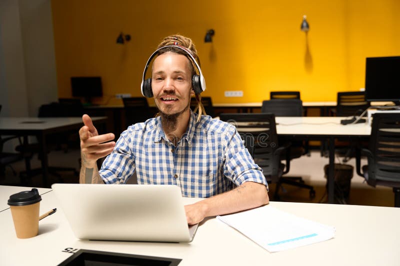 Informal Man in Plaid Shirt Communicates Online at Office Desk Stock ...