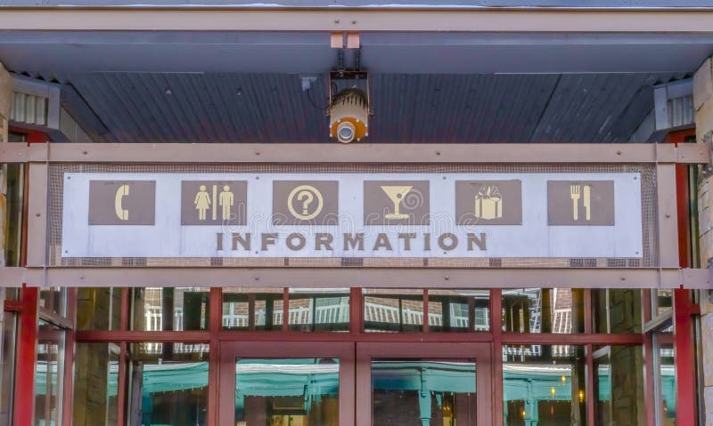 Information Sign at the Entrance of a Building with Reflective Glass ...