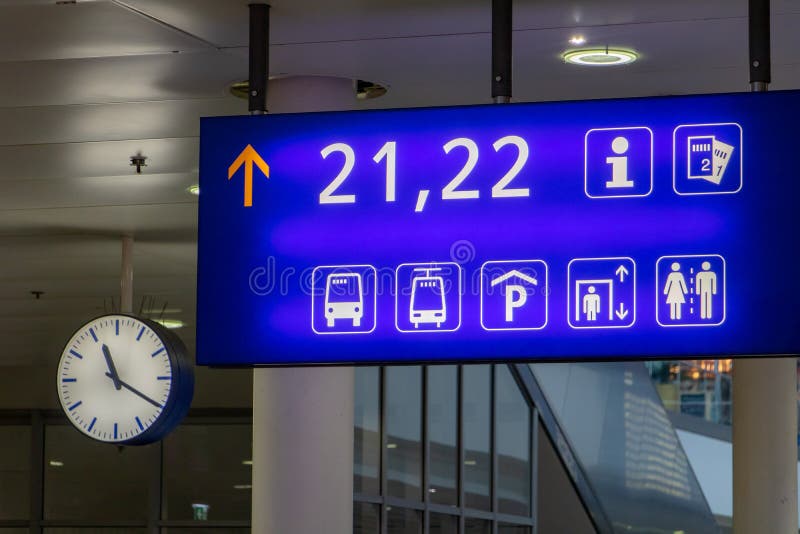 The Information Signs and Clock Hang Stock Photo - Image of direction ...
