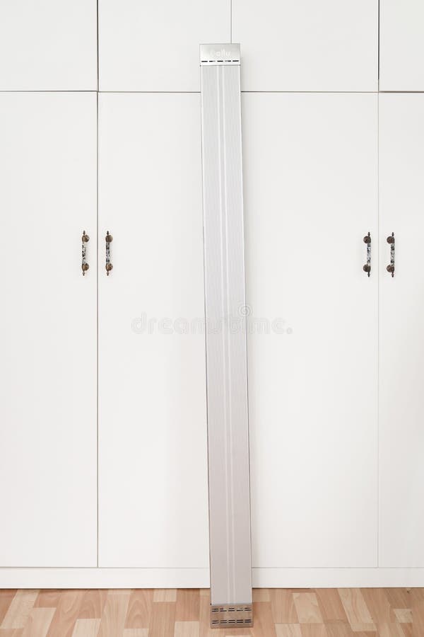 Infrared Heater on a White Cupboard Background. a Heating Device ...