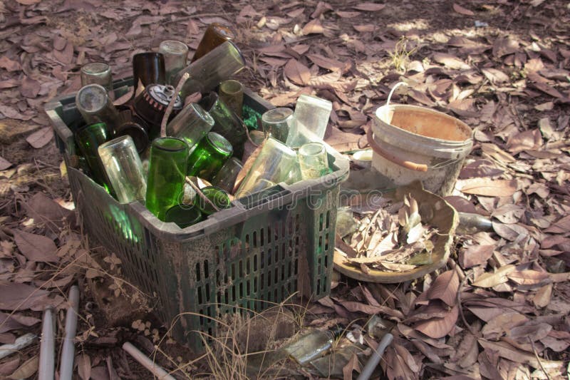 Plastic Bucket of Empty Bottles Left on the Ground. Stock Image - Image ...