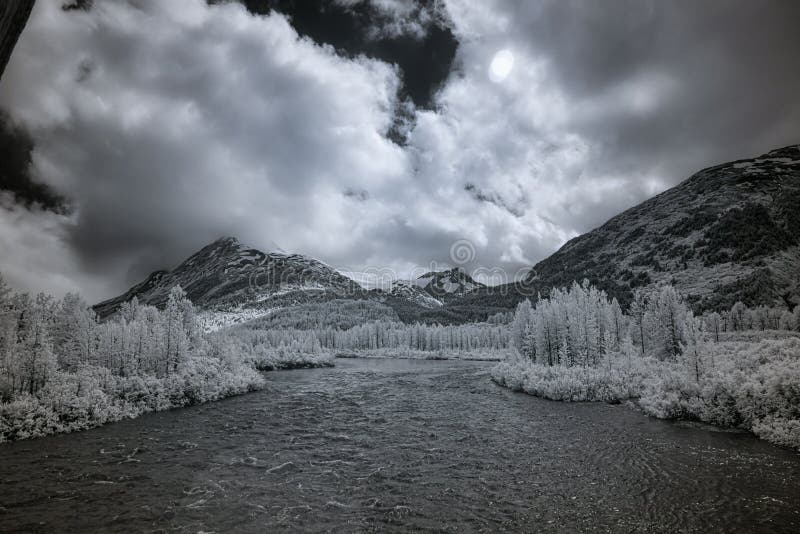 Infrared Landscape of River, Forest, and Mountains Under Dramatic Sky ...