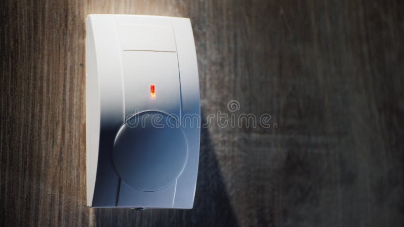 Infrared Motion Sensor on the Wall, Triggered and Lit Up by a Red Light ...