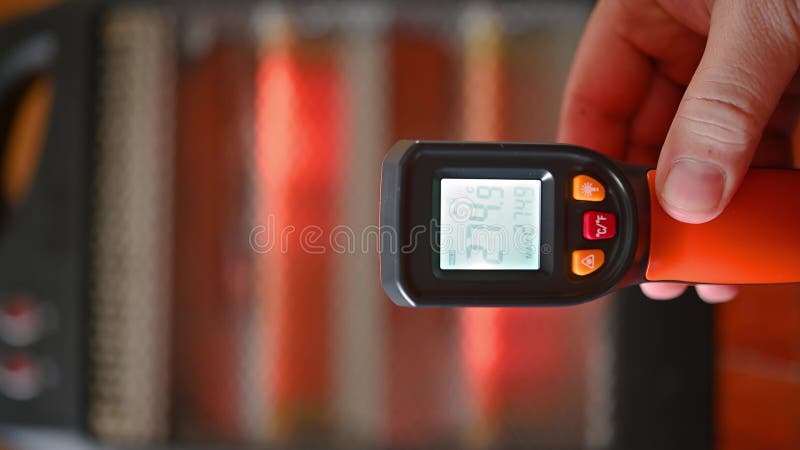 An Infrared Thermometer Shows the Temperature Change of an Electric ...