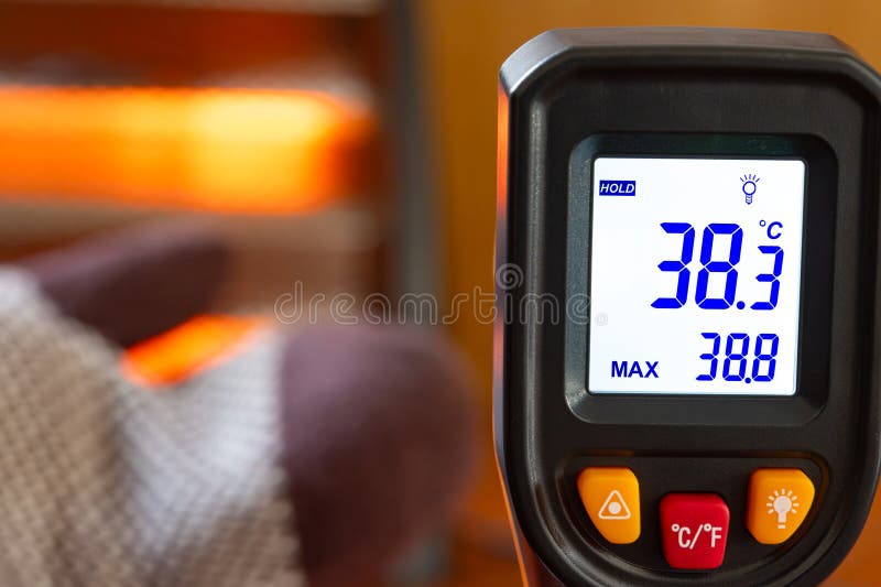 Infrared Thermometer Shows the Temperature of a Glove in Front of ...