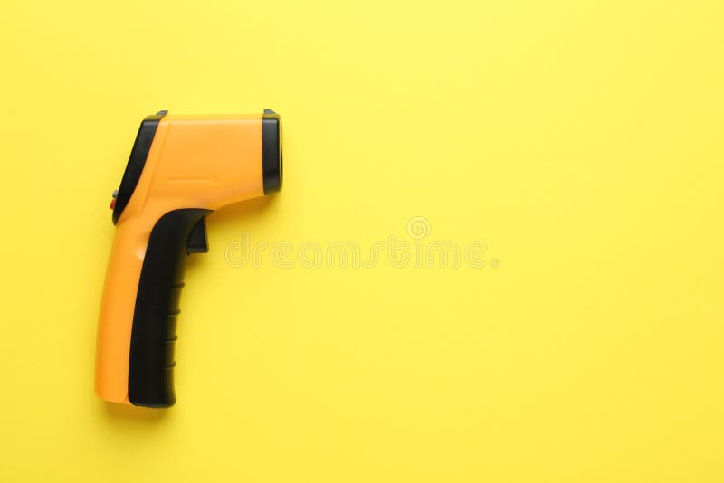 Infrared Thermometer on Yellow Background, Top View with Space for Text ...