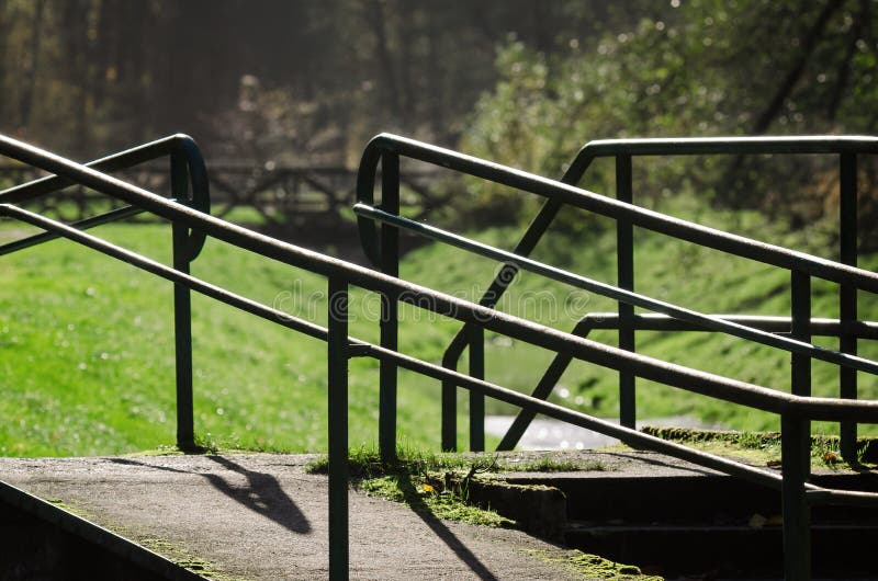 HANDRAILS on the CAUSEWAY stock image. Image of garden - 212409663