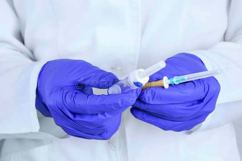 Infusion System with a Needle in the Hands of a Nurse. Stock Photo ...