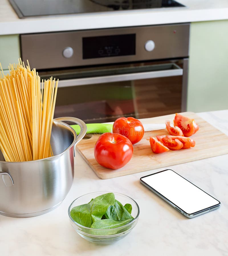 Ingredients for Cooking Pasta with Tomatoes and Spinach on the Kitchen ...