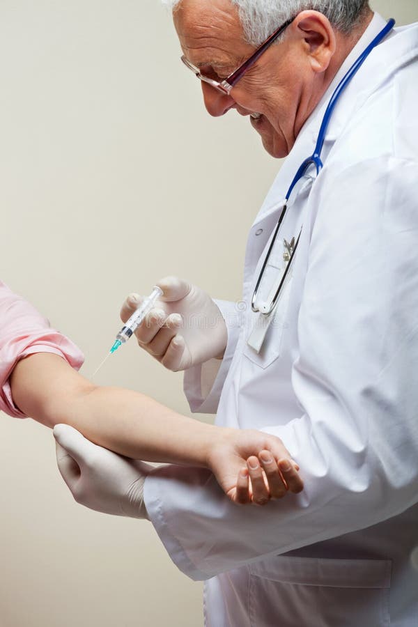 Injection in Arm stock photo. Image of anonymous, adult - 36290400