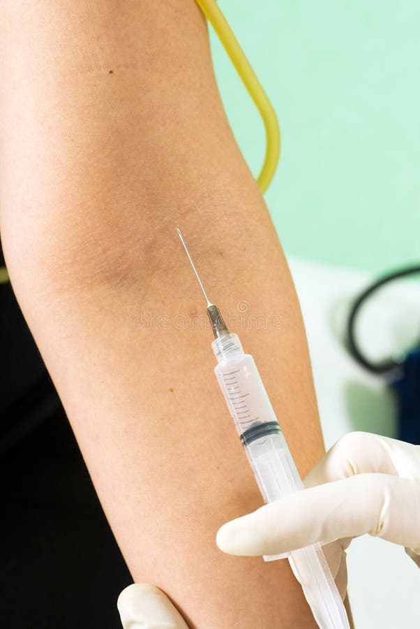 Injection in Arm - Vertical Stock Image - Image of midlife, vaccine ...