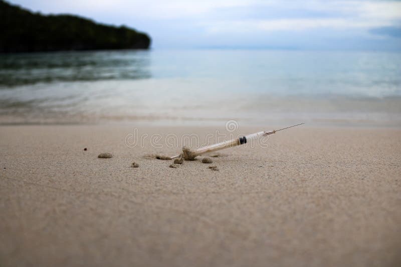 Injection Needles on the Beach. Stock Photo - Image of medicine ...