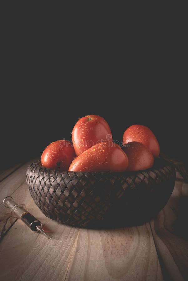 Injection of Poisonous Toxin into an Organic Tomato Stock Image - Image ...