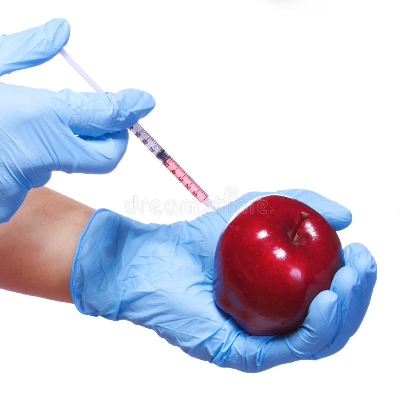 Injection into Red Apple Isolated on White Background. Genetically ...