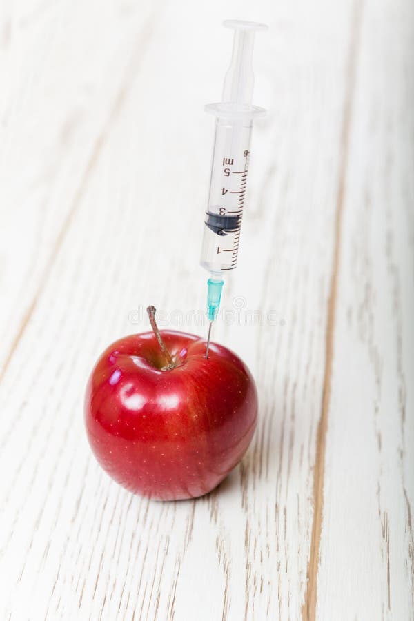 Injection into red apple stock photo. Image of healthy - 40752214