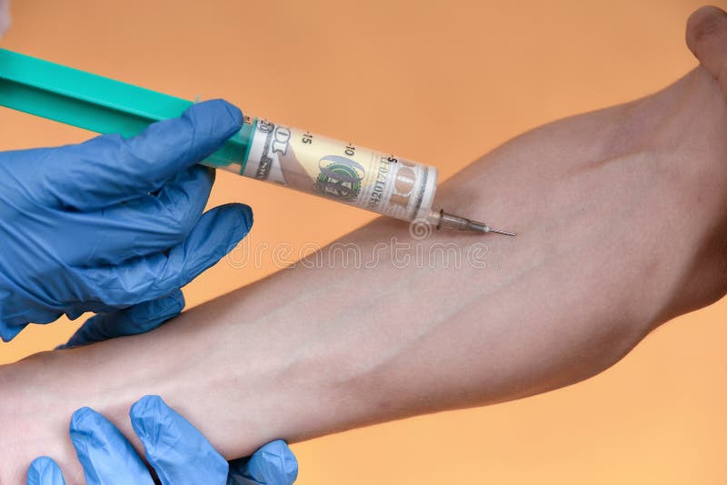 Injection with a Syringe with Dollars into a Vein in the Patient`s Arm ...