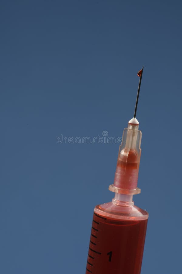 Injection Syringe with Needle Detail on Colored Background Stock Photo ...