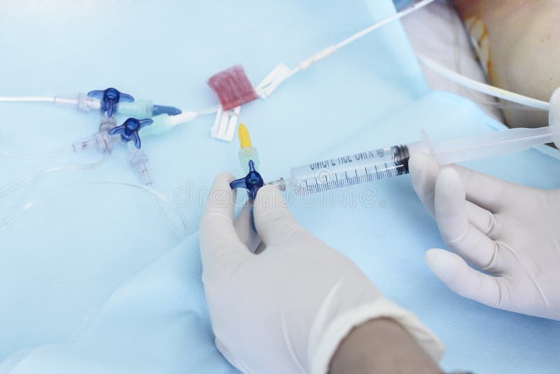 Injection into the Venous Catheter. Work of a Nurse Stock Image - Image ...