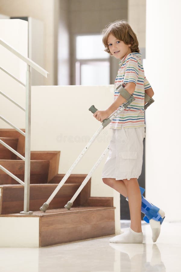 Injured Child on Crutches. Boy in Cast on Foot Stock Photo - Image of ...