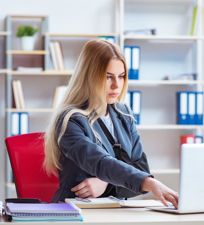 Injured Female Employee Working in the Office Stock Photo - Image of ...