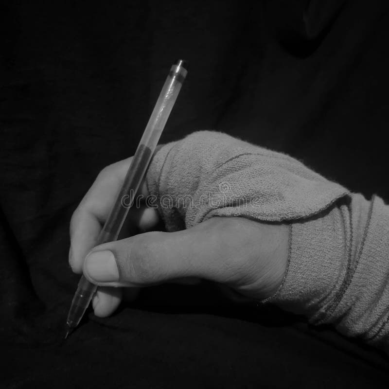 Injured Hand Writing Isolated on Pure Black Stock Photo - Image of ...