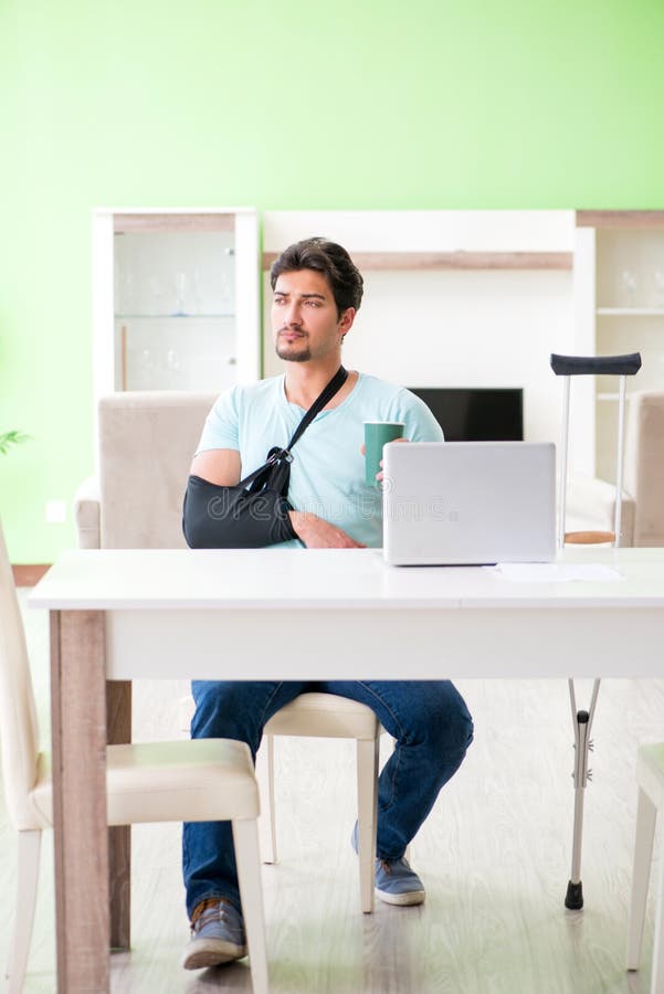 The Injured Man with Crutches Sitting at Home Stock Image - Image of ...