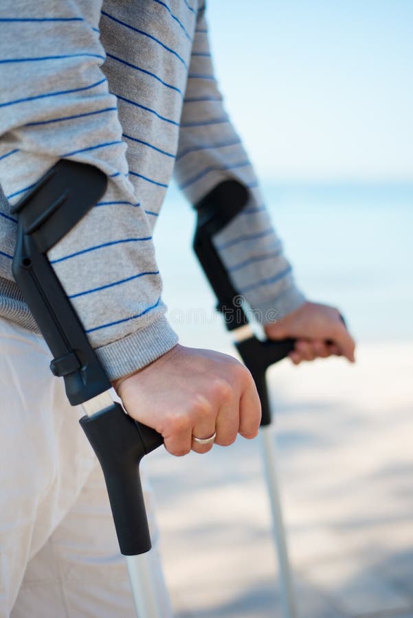 Injured Man Standing with Crutches Stock Photo - Image of bandage ...