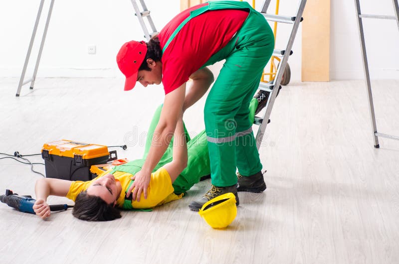 The Injured Worker and His Workmate Stock Photo - Image of hardhat ...