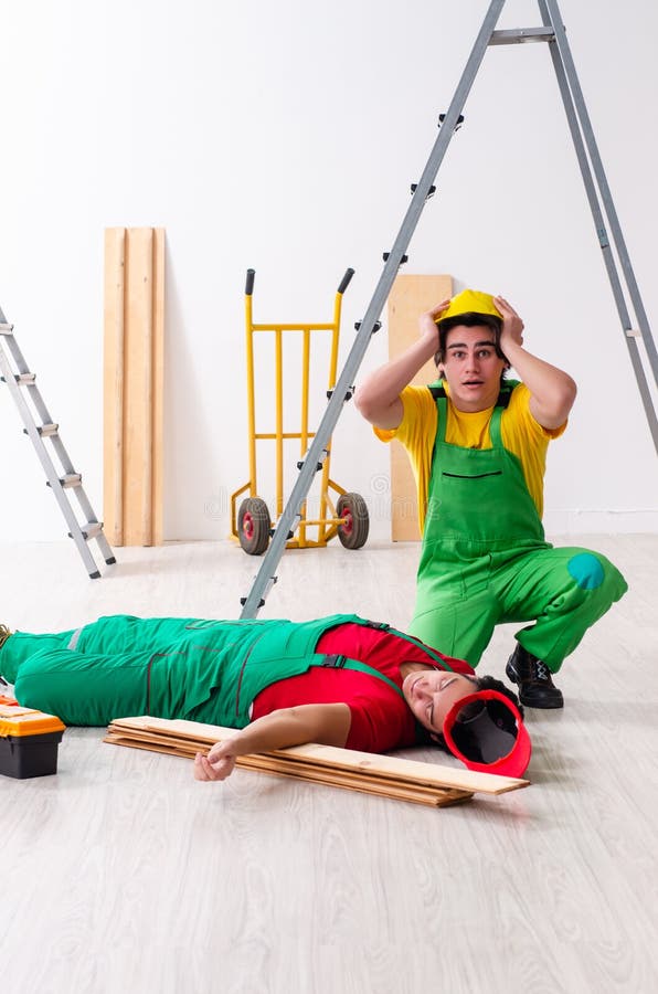 Injured Worker and His Workmate Stock Photo - Image of fall ...