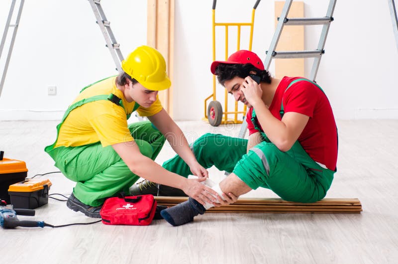 Injured Worker and His Workmate Stock Photo - Image of injured ...