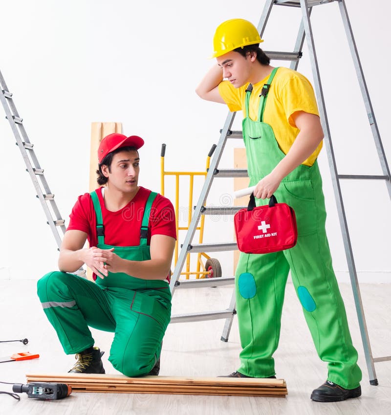 Injured Worker and His Workmate Stock Image - Image of paramedic, hand ...