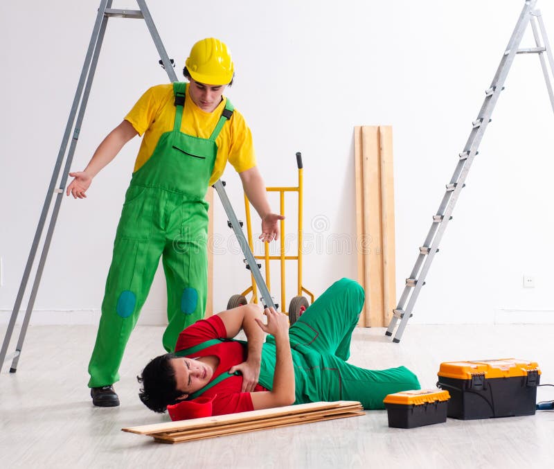 Injured Worker and His Workmate Stock Photo - Image of health, fixing ...