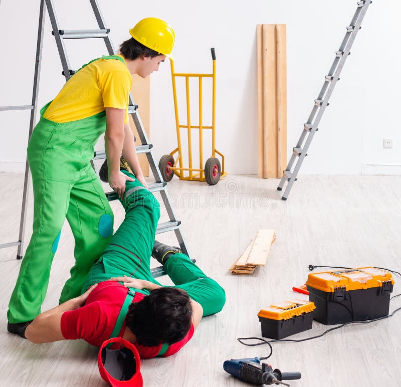 Injured Worker and His Workmate Stock Photo - Image of fatality, fixing ...