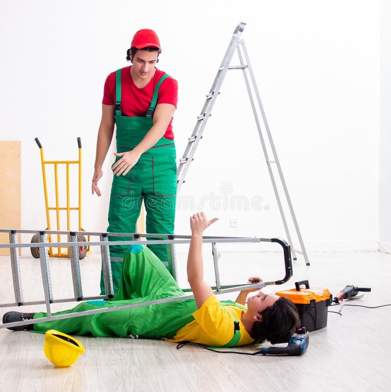 Injured Worker and His Workmate Stock Photo - Image of injury, falling ...