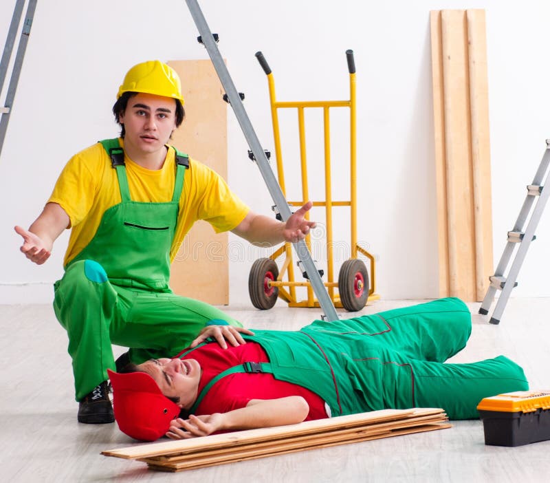 Injured Worker and His Workmate Stock Photo - Image of emergency, house ...