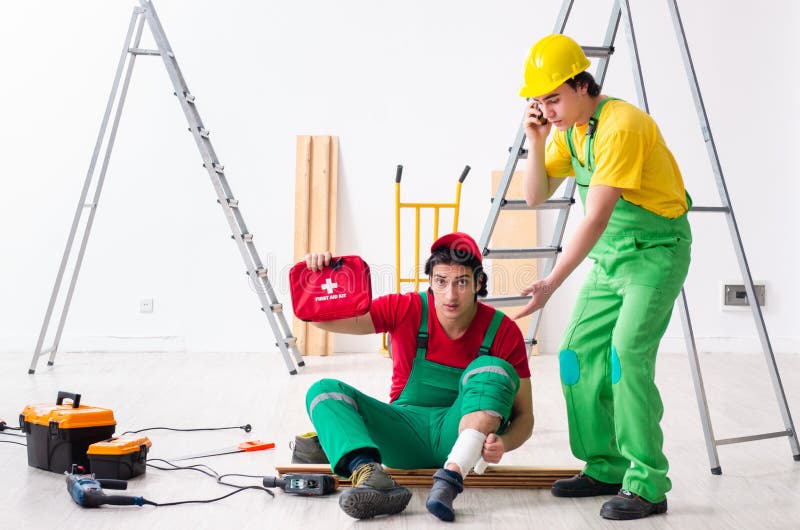 The Injured Worker and His Workmate Stock Photo - Image of broken ...