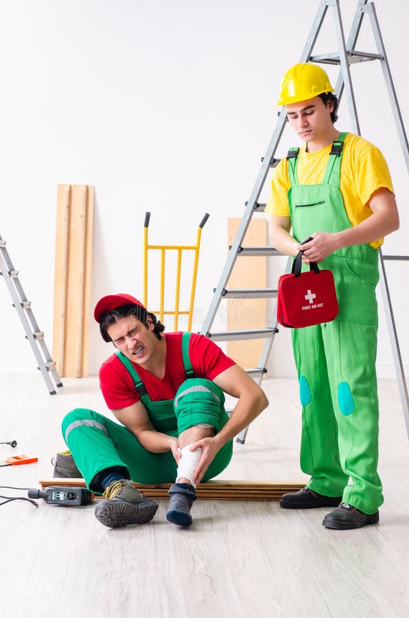 Injured Worker and His Workmate Stock Image - Image of broken ...