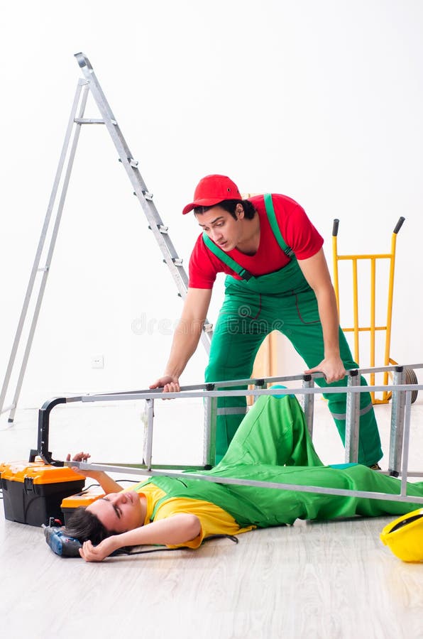 Injured Worker and His Workmate Stock Image - Image of building ...