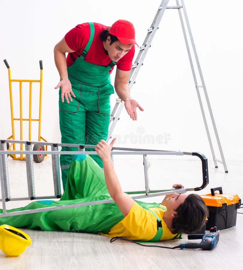 Injured Worker and His Workmate Stock Photo - Image of ladder, floor ...