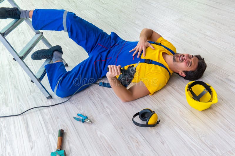The Injured Worker at the Work Site Stock Photo - Image of chest ...