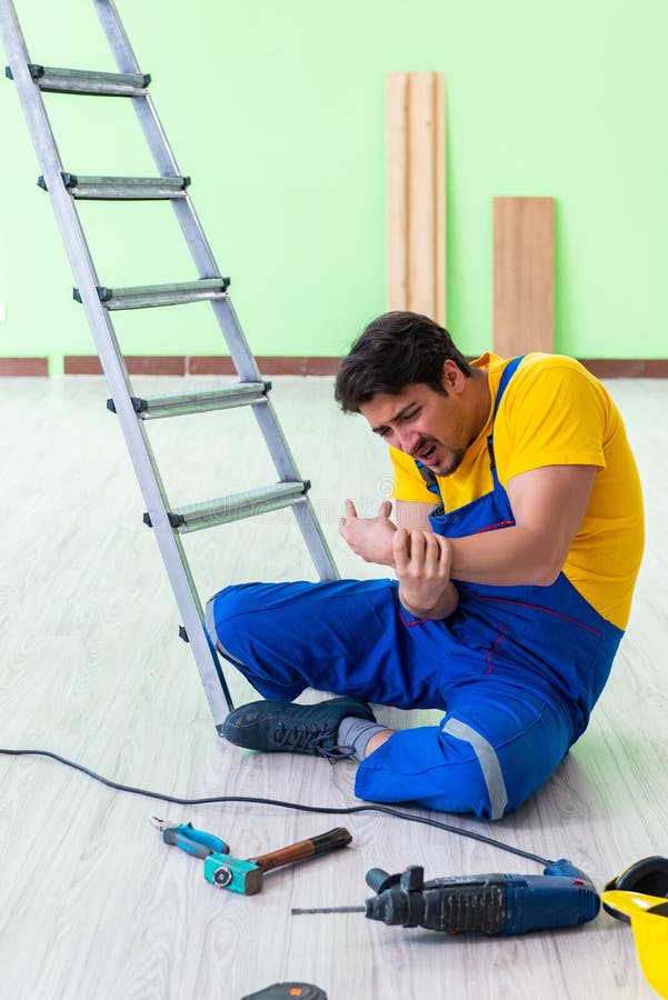 The Injured Worker at the Work Site Stock Image - Image of painful ...