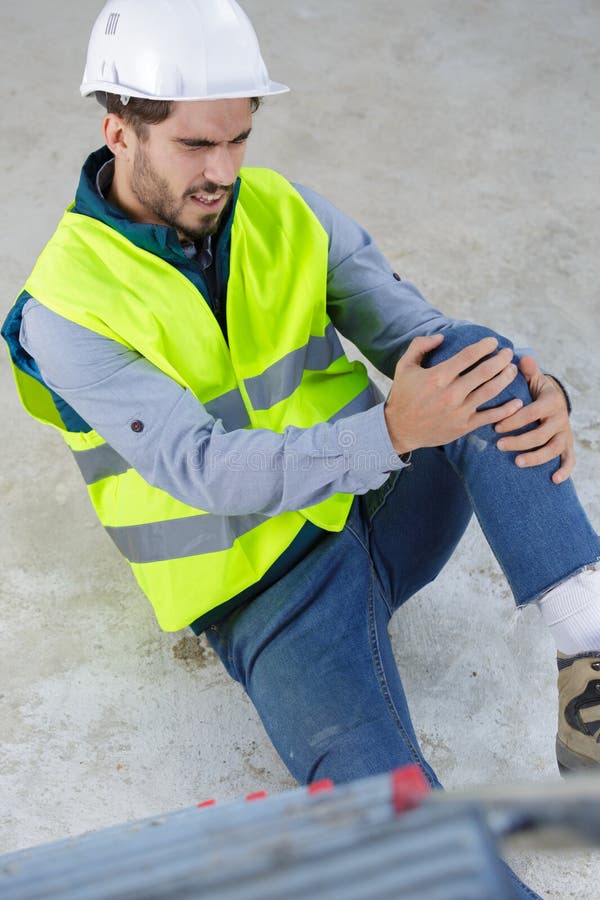 Man Worker with Knee Injury Concept Accident at Work Stock Photo ...