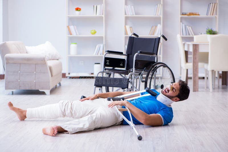 The Injured Young Man Recovering at Home Stock Photo - Image of chair ...