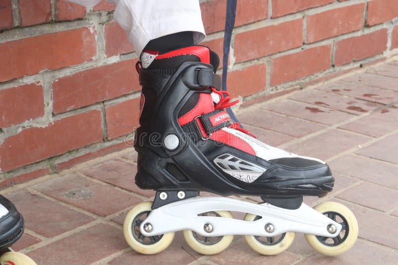 Inline Skates with Leg on Road Stock Image - Image of street, lifestyle ...