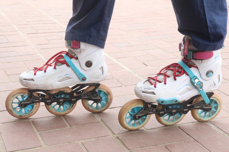 Inline Skates with Leg on Road Stock Photo - Image of pretty, putting ...
